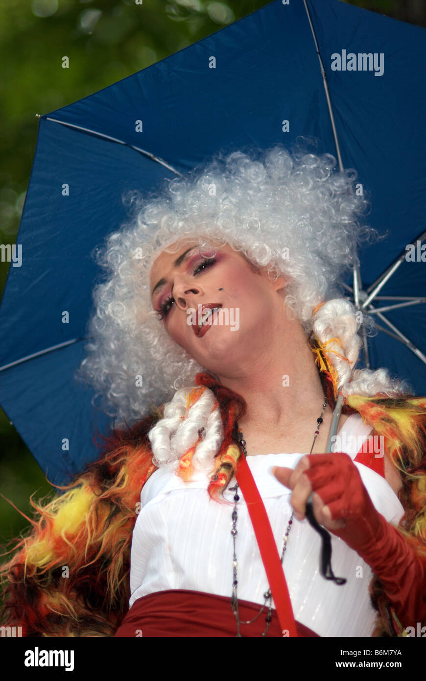 Christopher Street Day Berlin Person dressed as woman with umbrella ...