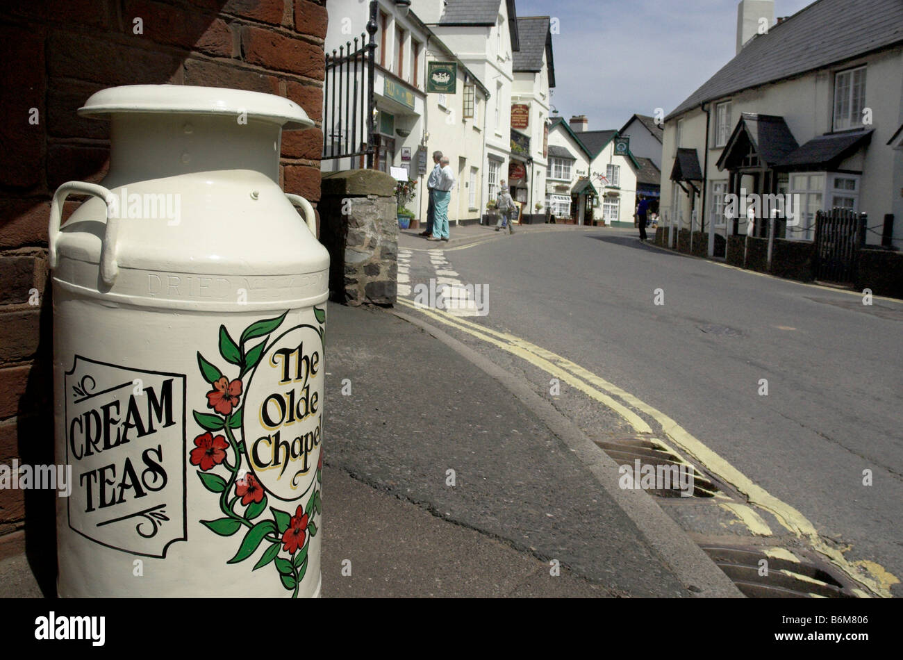 An old butter churn advertising cream teas in Porlock in Devon Stock ...