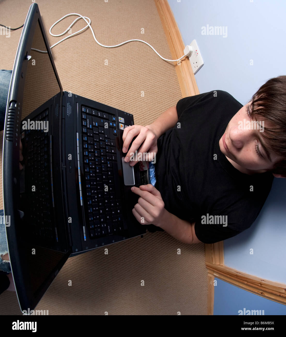 13 year old boy teenager with laptop computer Stock Photo - Alamy