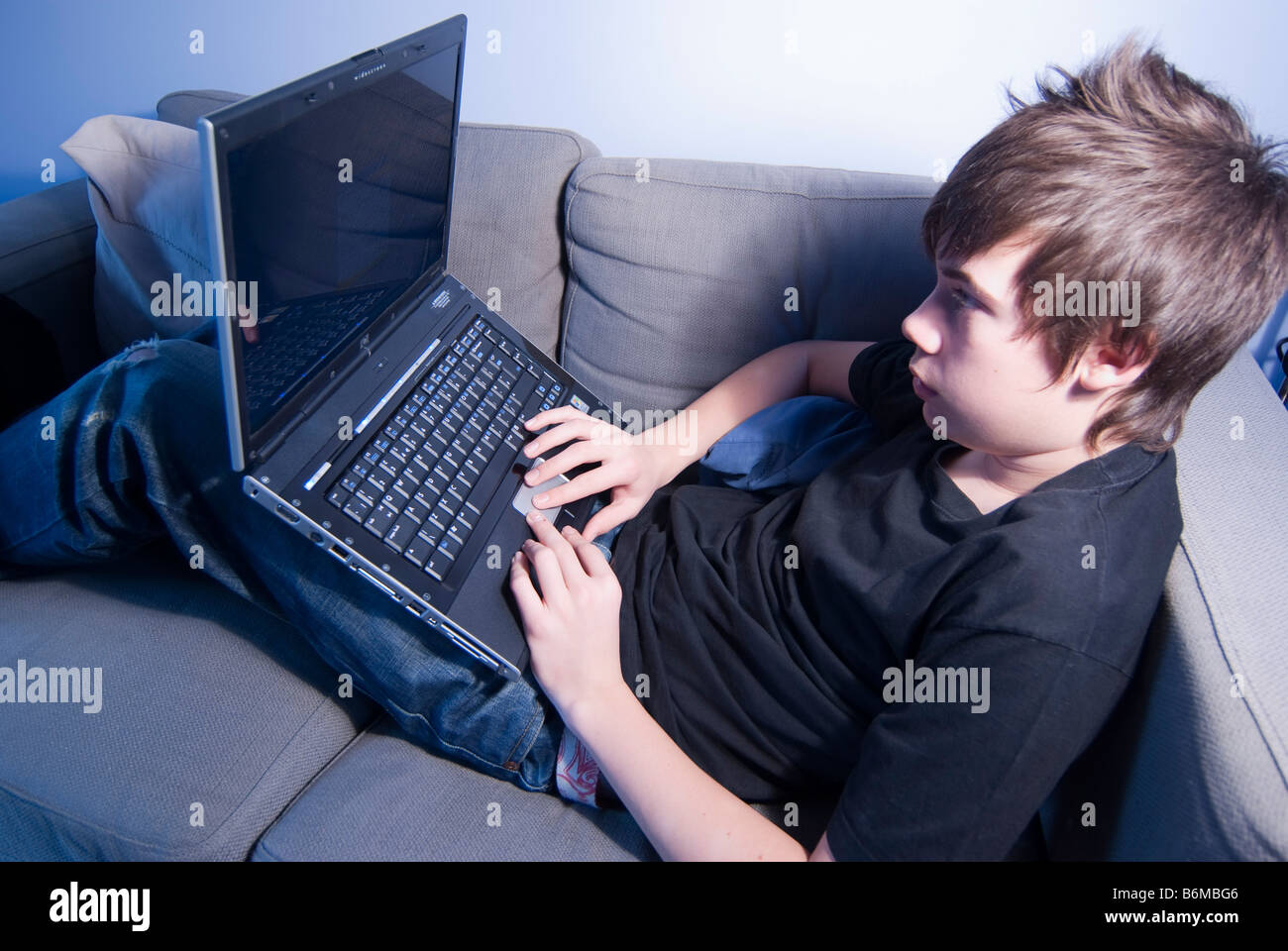 13 year old boy teenager with laptop computer Stock Photo - Alamy