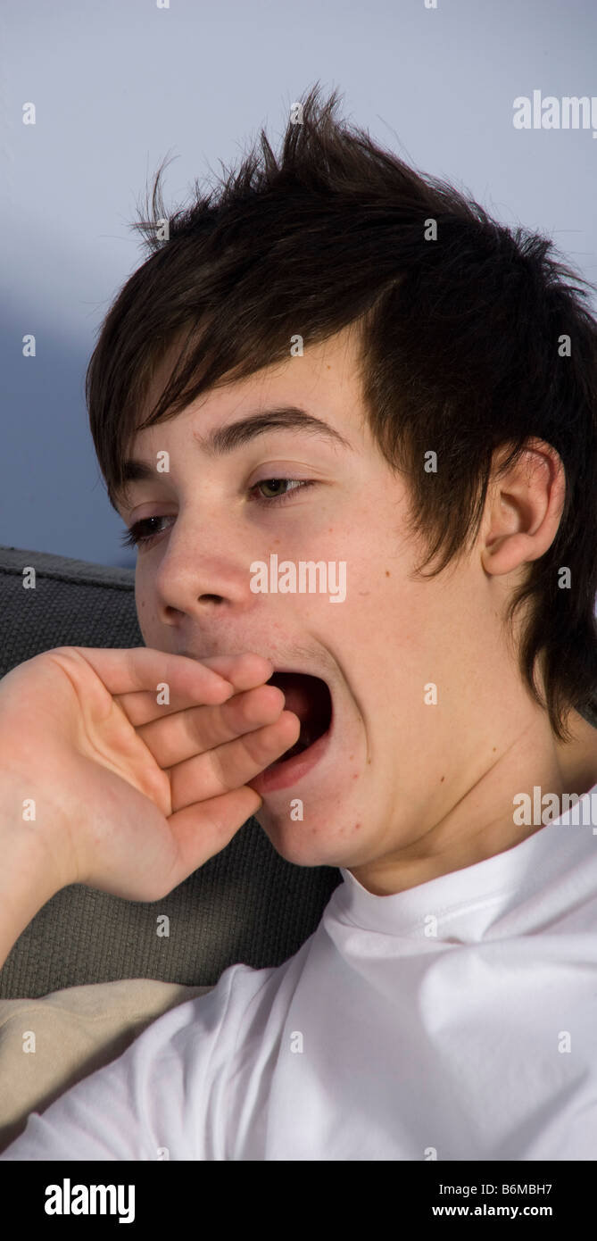 teenage boy sleeping on couch Stock Photo - Alamy