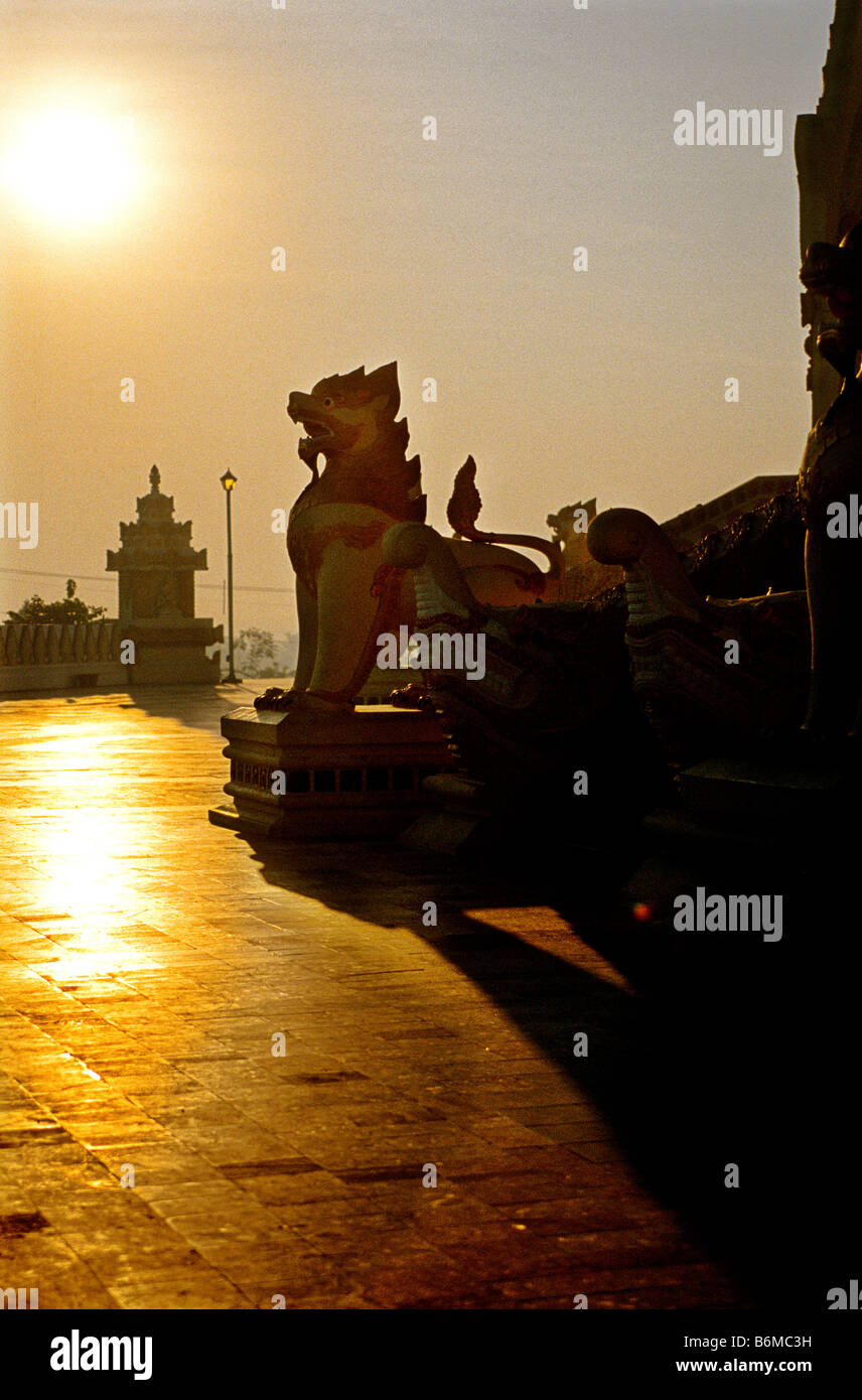Silhouette of guardian statue at the Botataung Paya Rangon Burma ...