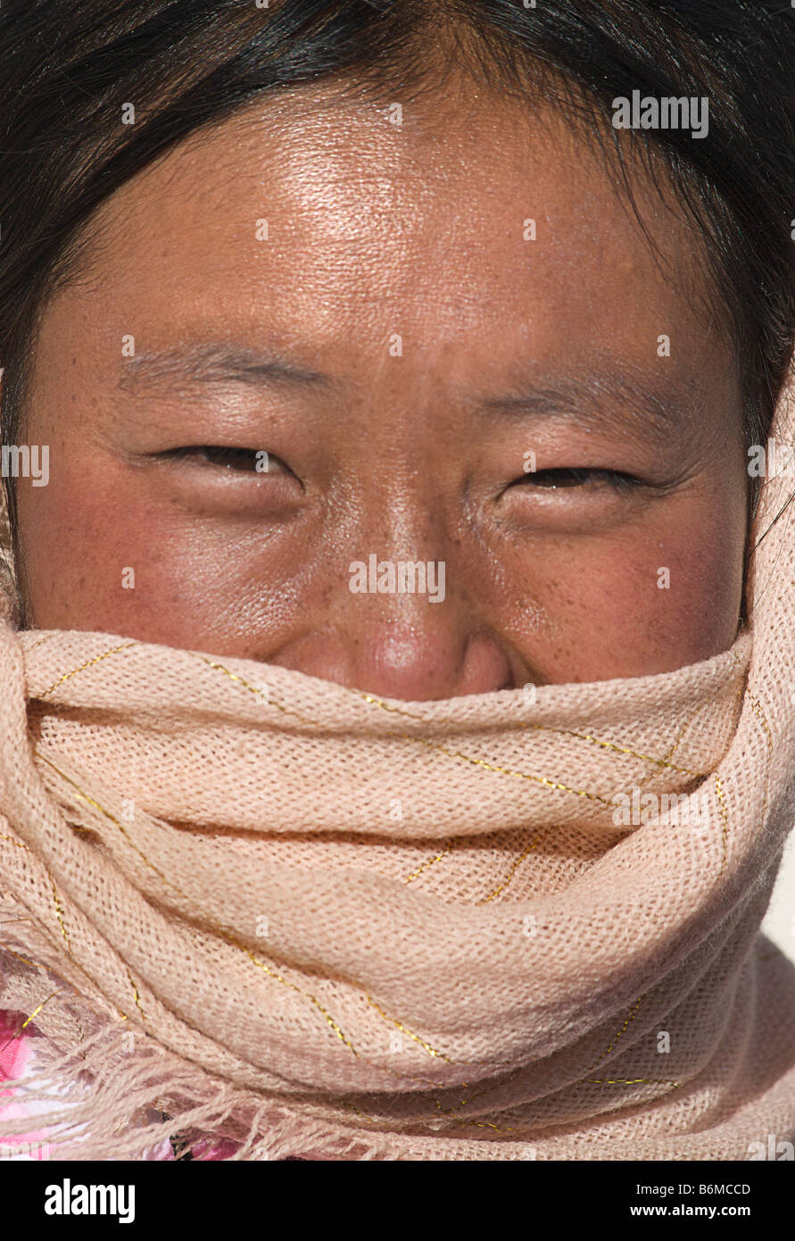 Portrait of a Tibetan woman part shielding her face Stock Photo - Alamy