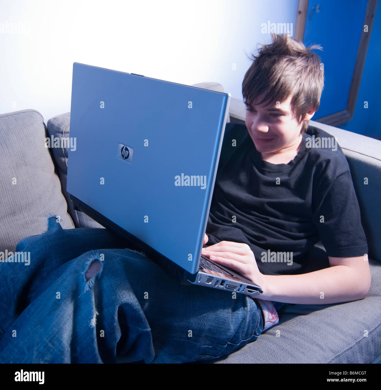 13 year old boy teenager with laptop computer Stock Photo - Alamy