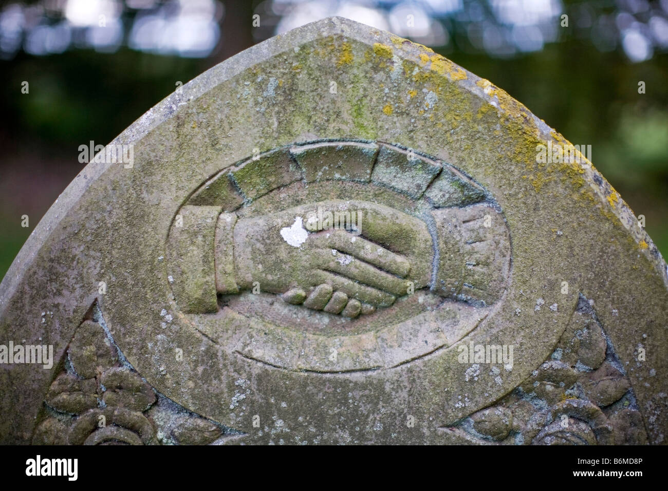 handshake on a gravestone Stock Photo - Alamy
