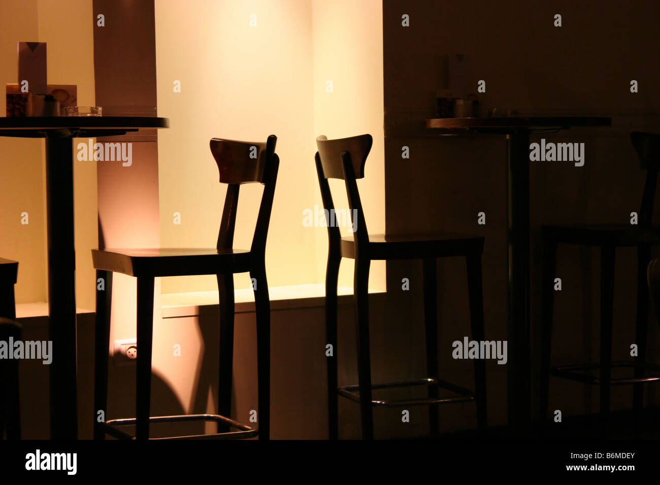 atmospheric Cafe Indoors with high stools and small tables Stock Photo ...