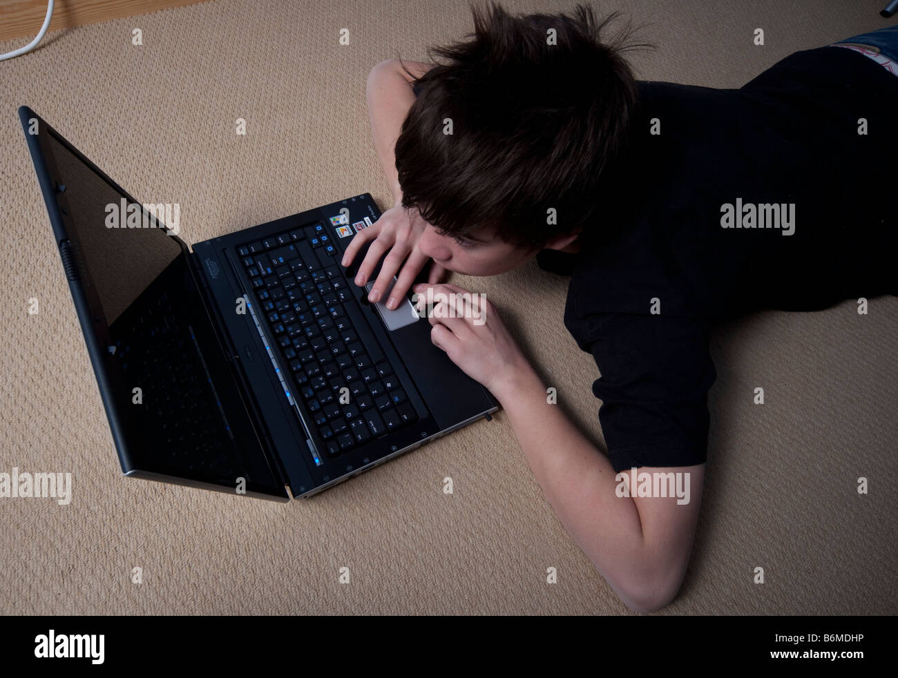 13 year old boy teenager with laptop computer Stock Photo - Alamy