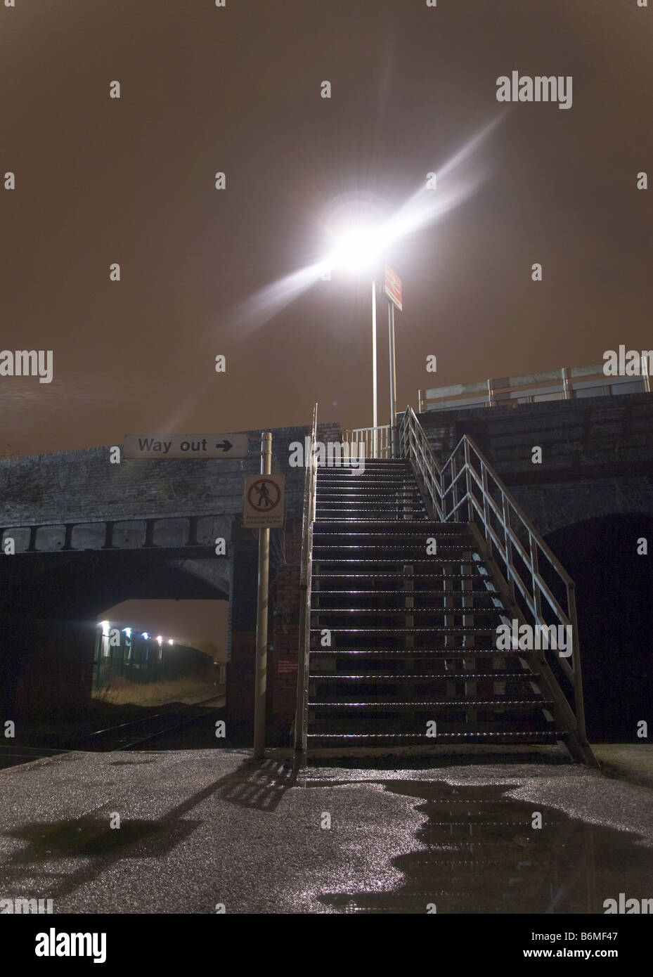 Steel Steps on Train Platform at Night With Lamp post Stock Photo - Alamy