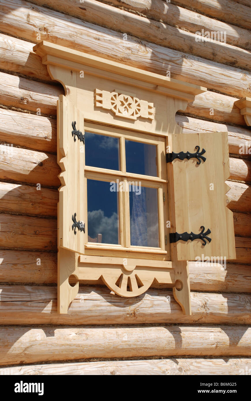 traditional beautifully decorated window of a wooden house Stock Photo ...