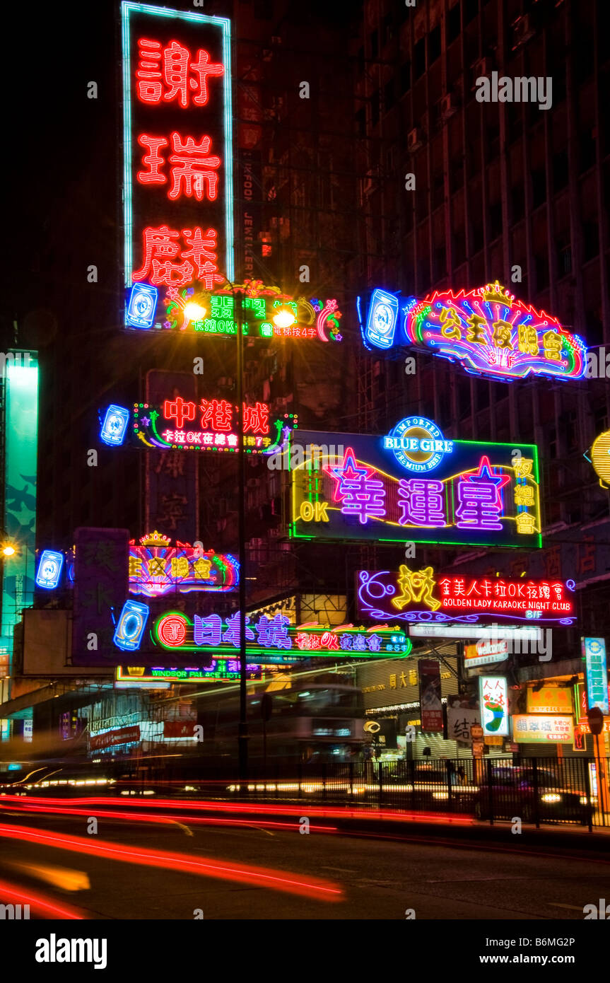 Streaked lights on cars at night on busy Hong Kong downtown street ...