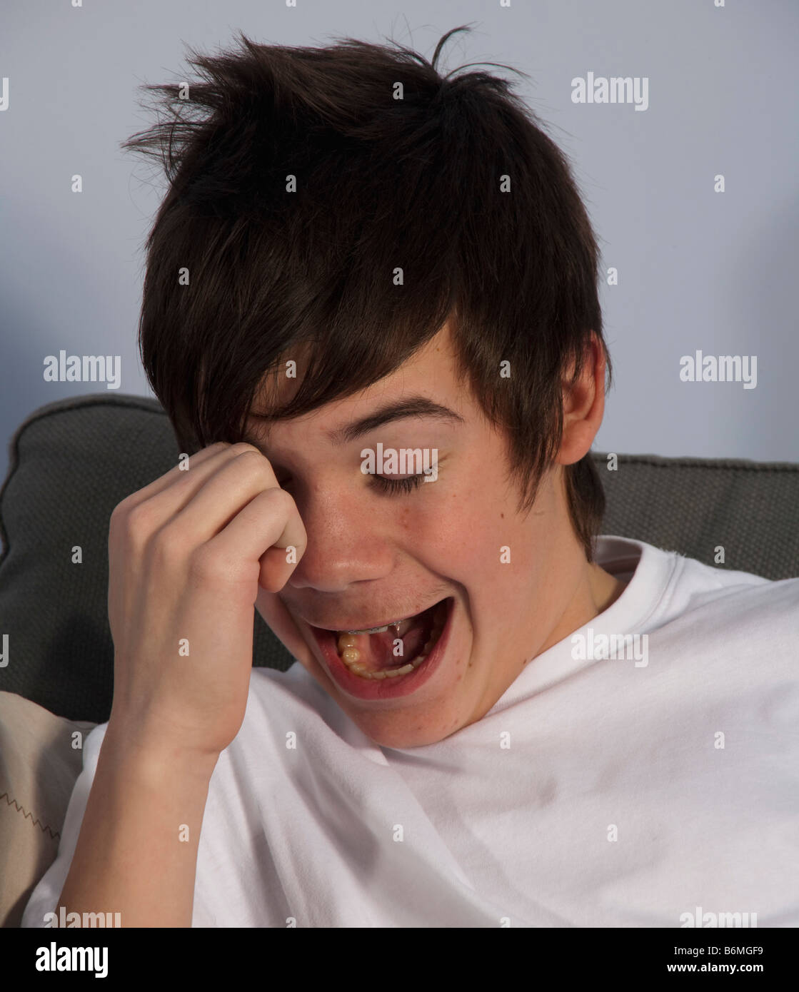 Teen boy sleeping on couch hi-res stock photography and images - Alamy