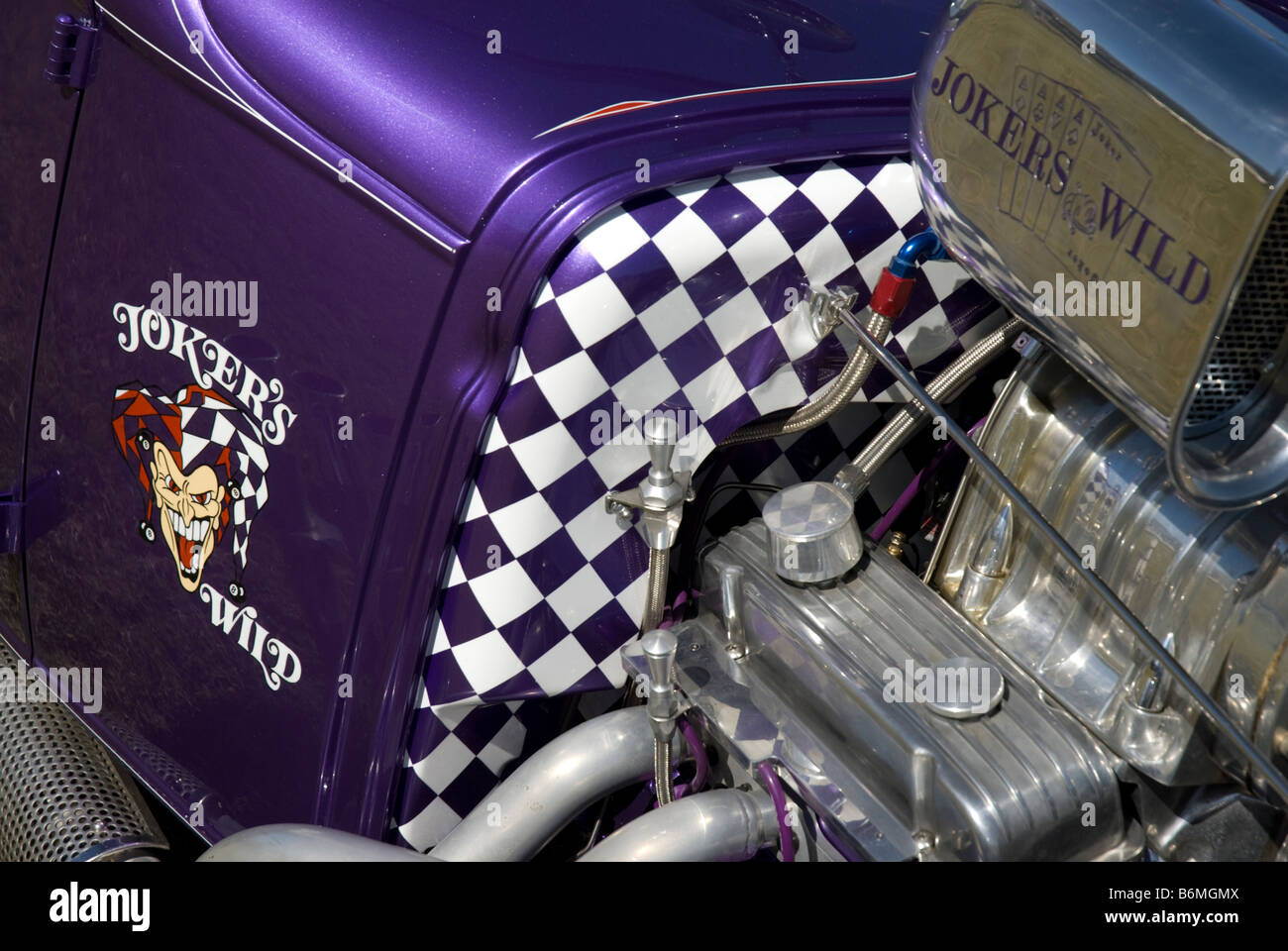 A photo showing the custom design work on the front of a purple hot rod ...