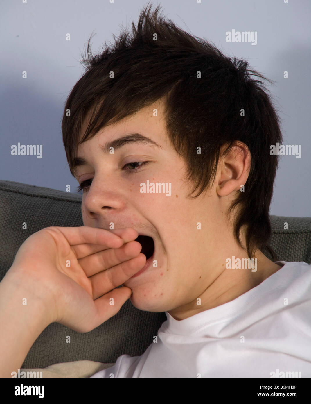 Teen boy sleeping on couch hi-res stock photography and images - Alamy