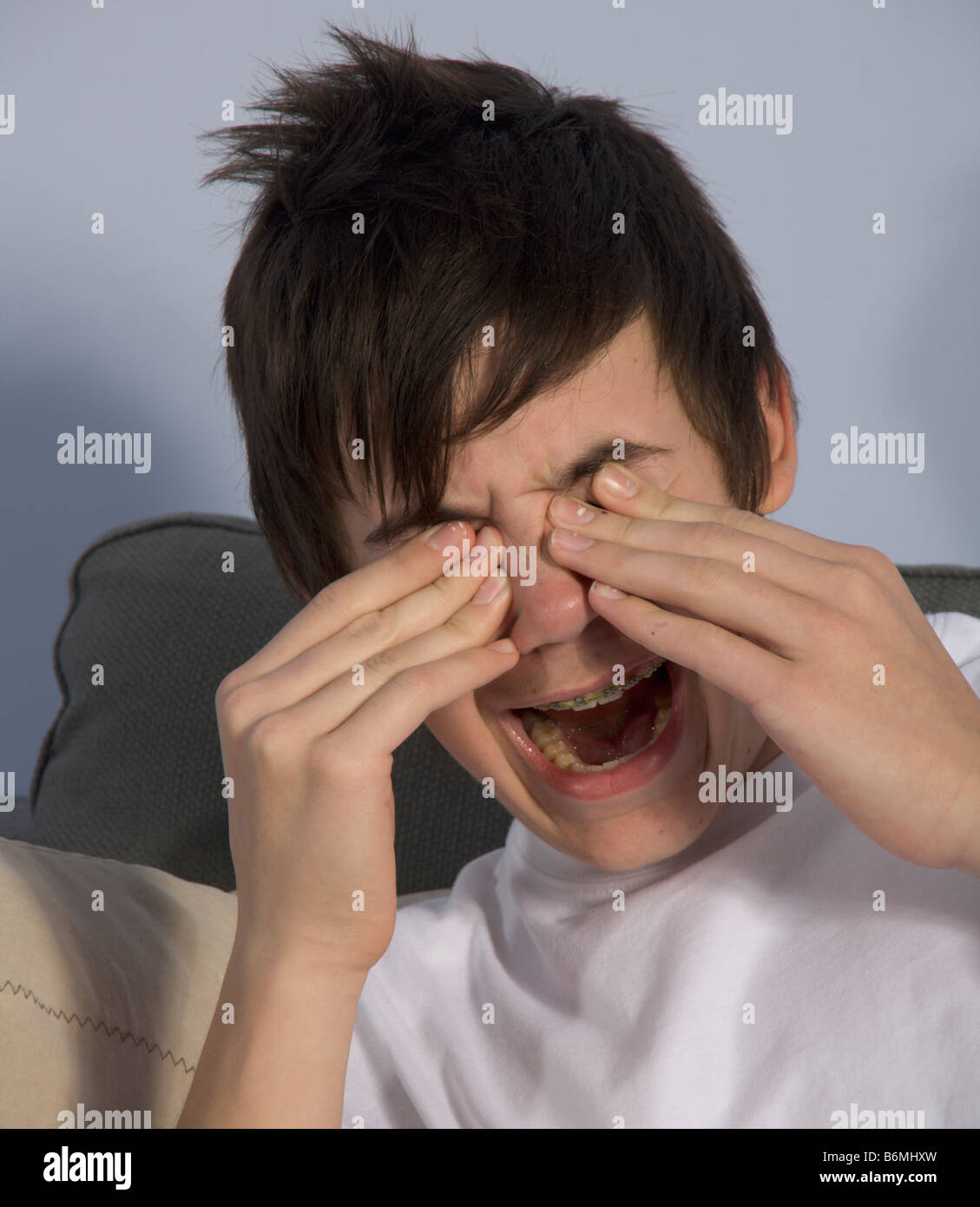 teenage boy sleeping on couch Stock Photo - Alamy