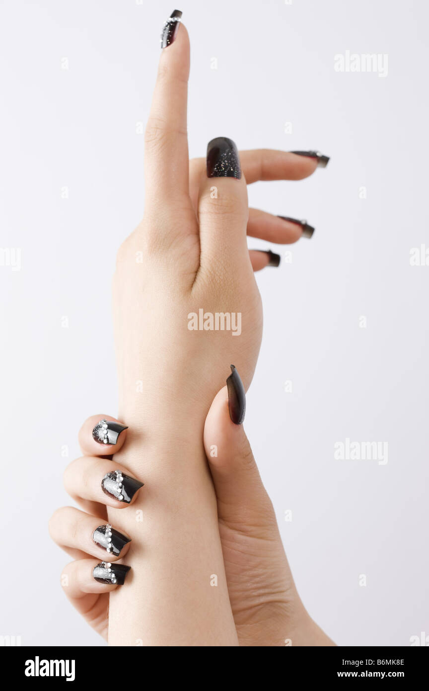 Woman s hand with artificial fingernail Stock Photo - Alamy