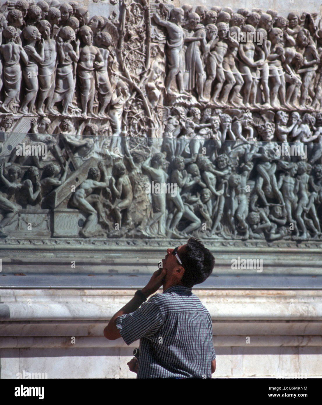 man looking at statue wall in Orvieto, Italy Stock Photo - Alamy