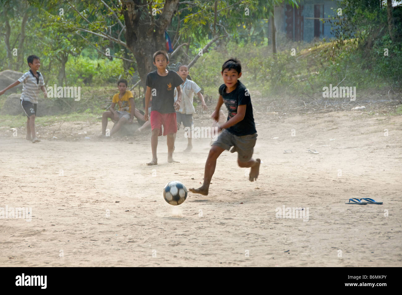 Burmese refugee children in Thailand playing football Stock Photo - Alamy