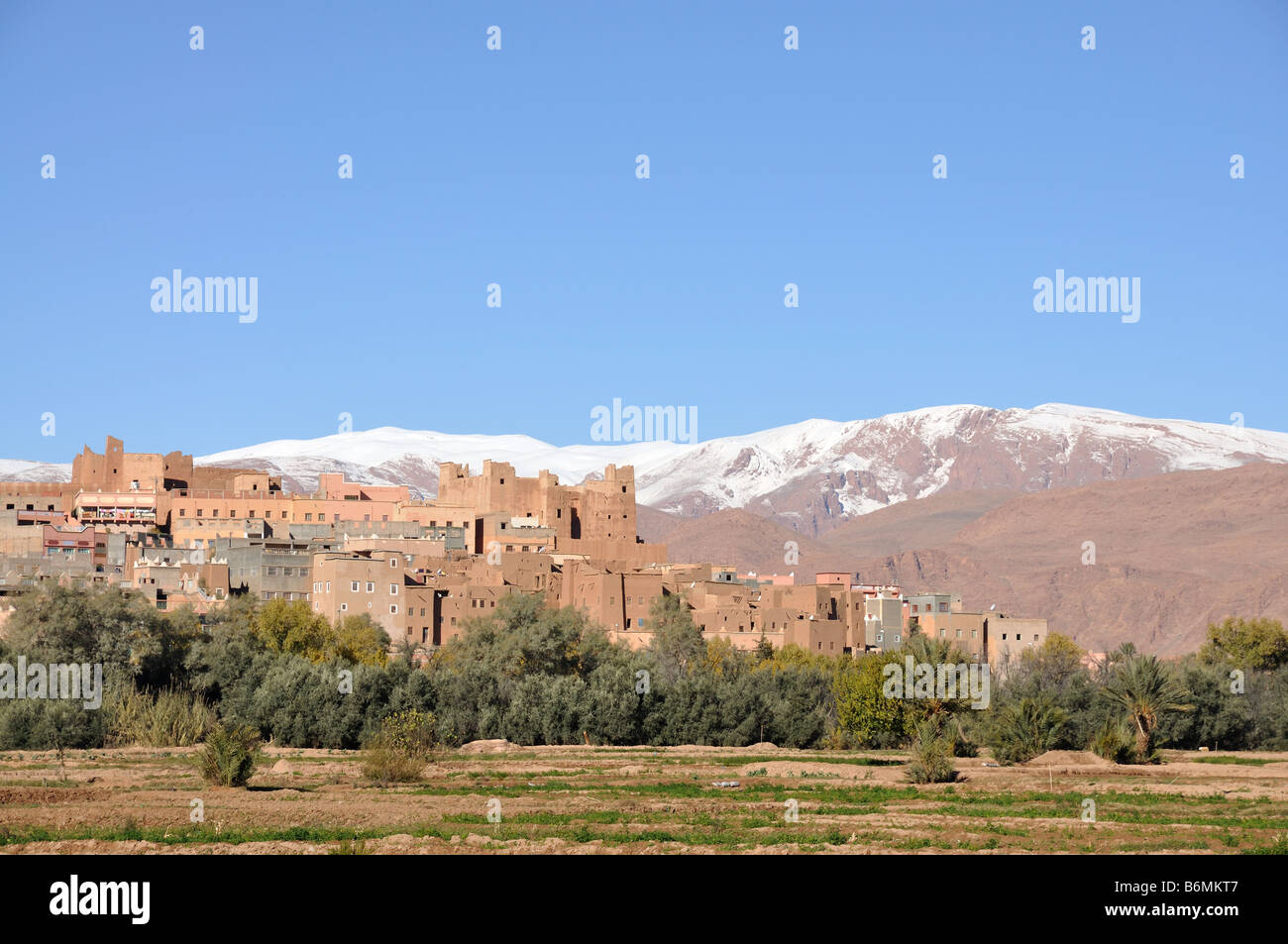 Moroccan village, Atlas mountains in the background Stock Photo - Alamy