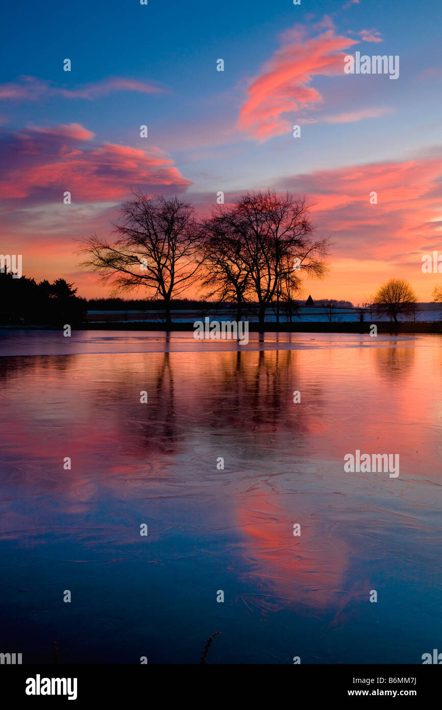 Sunset clouds trees water hi-res stock photography and images - Alamy