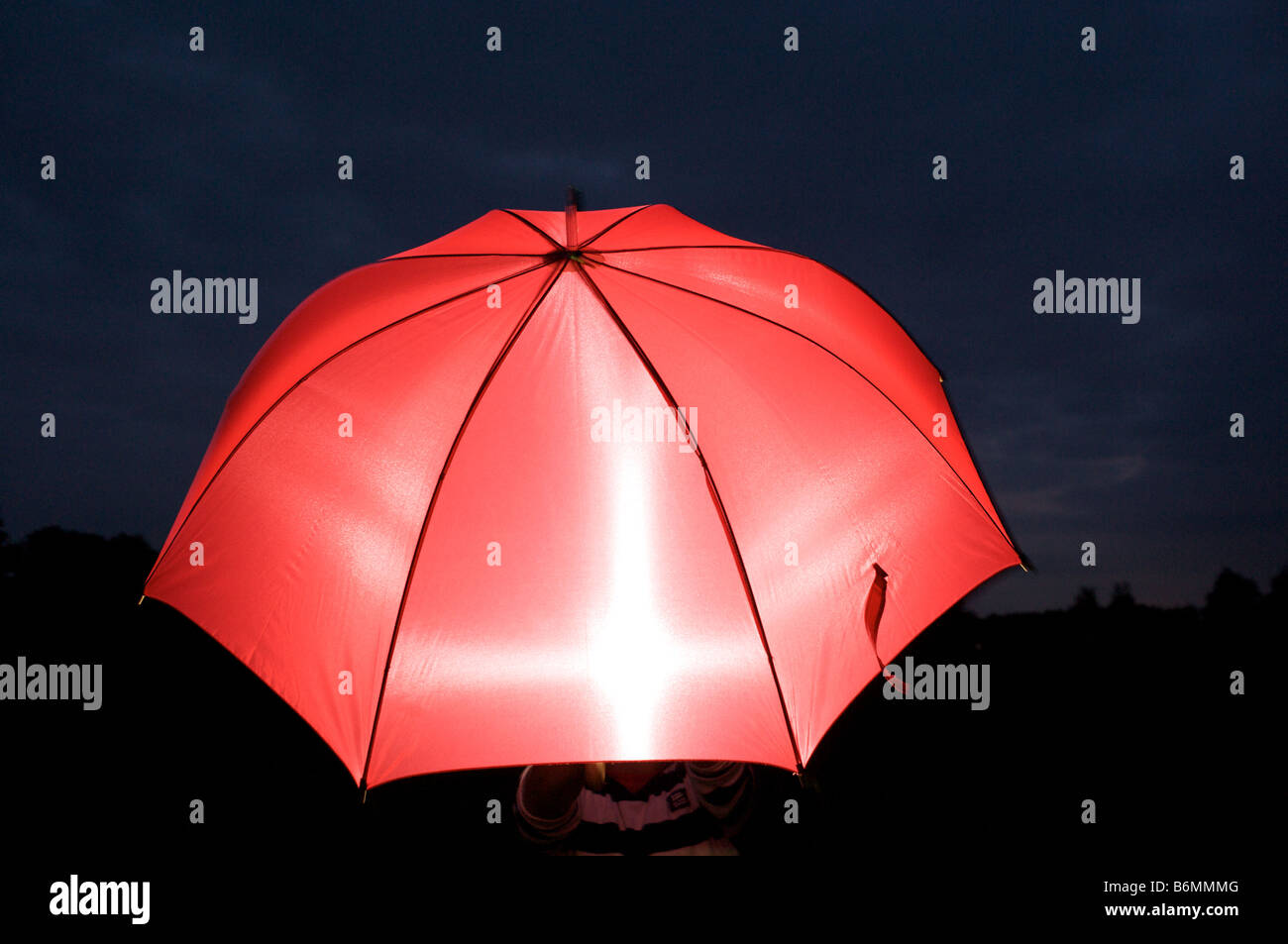 Red umbrella at night inside flash Stock Photo - Alamy