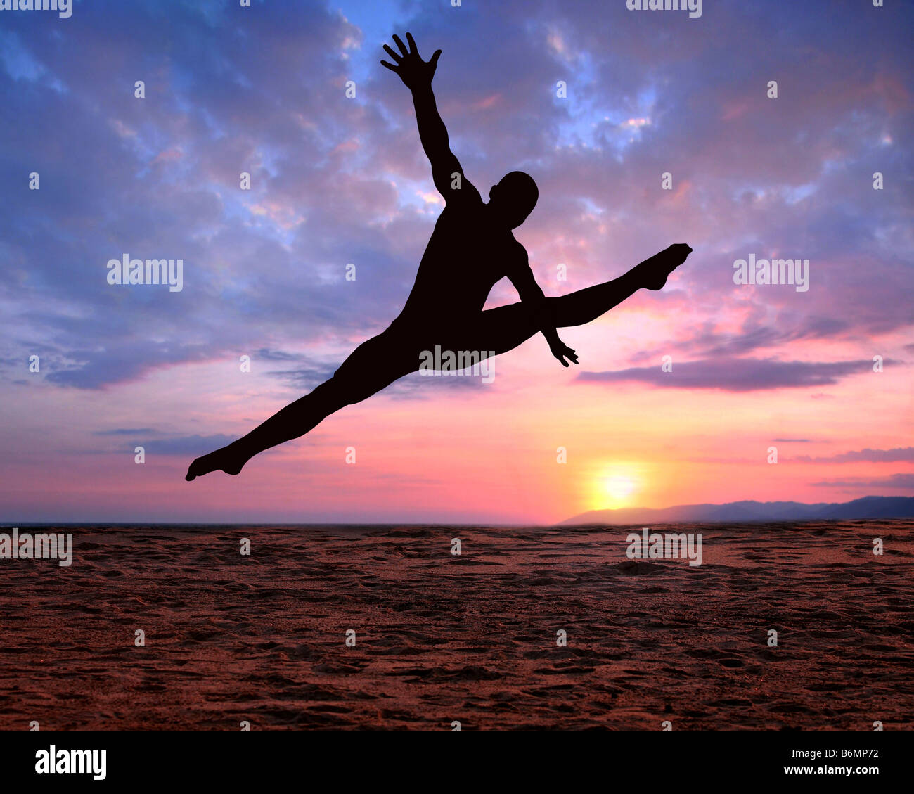 A silhouette of a jumping man on a colorful sunset background Stock ...