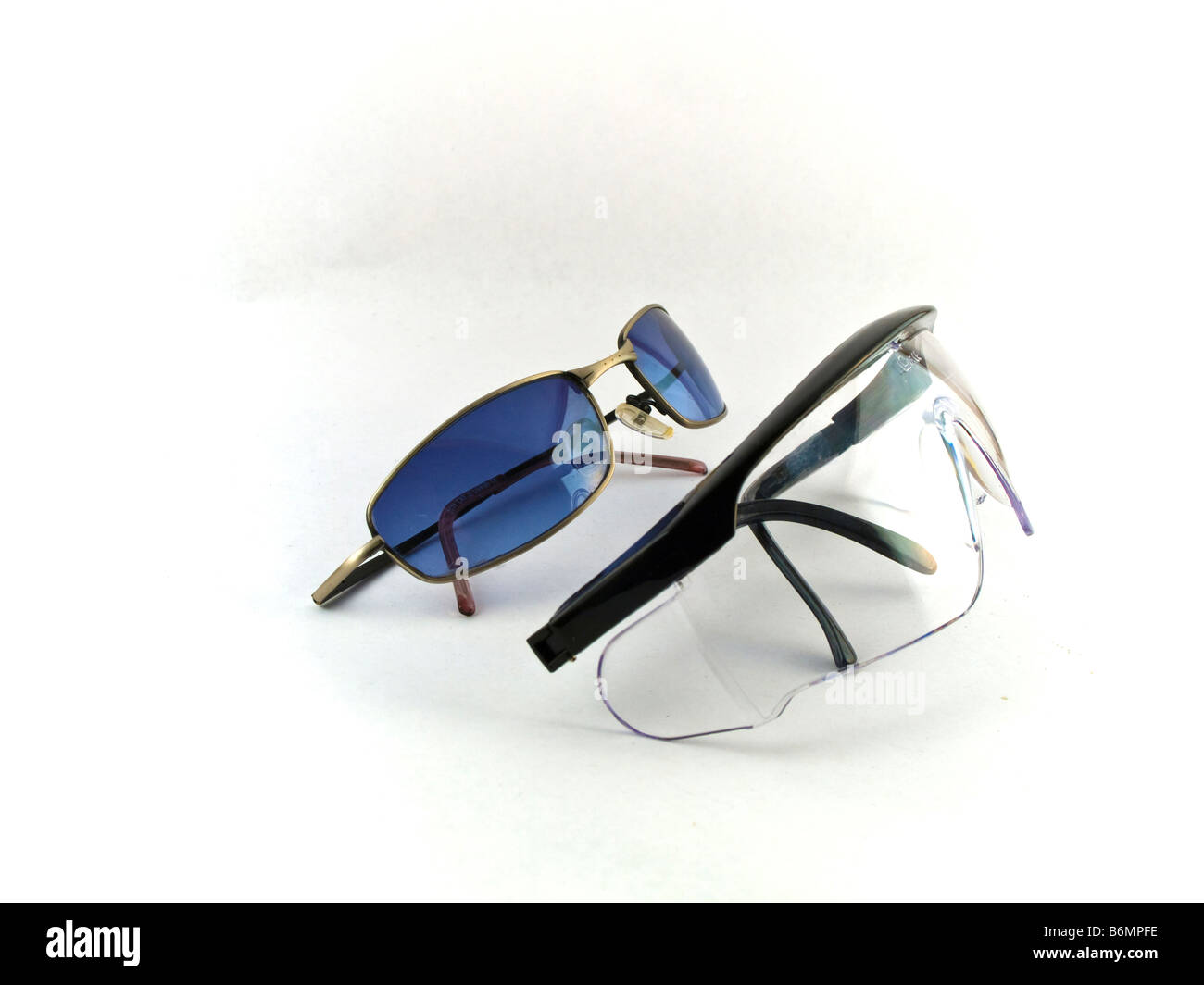 Sunglasses and Safety Goggles on White Background Stock Photo - Alamy