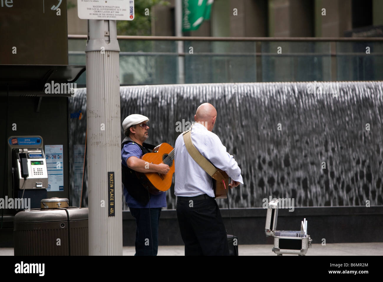 two adult males singing busking in sydney Stock Photo - Alamy
