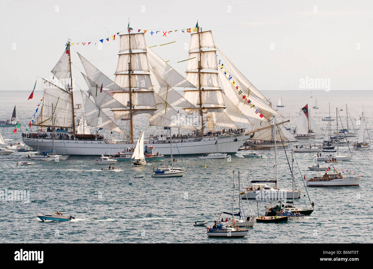 Three masted barque "Cuauhtémoc" surrounded by smaller ships during ...