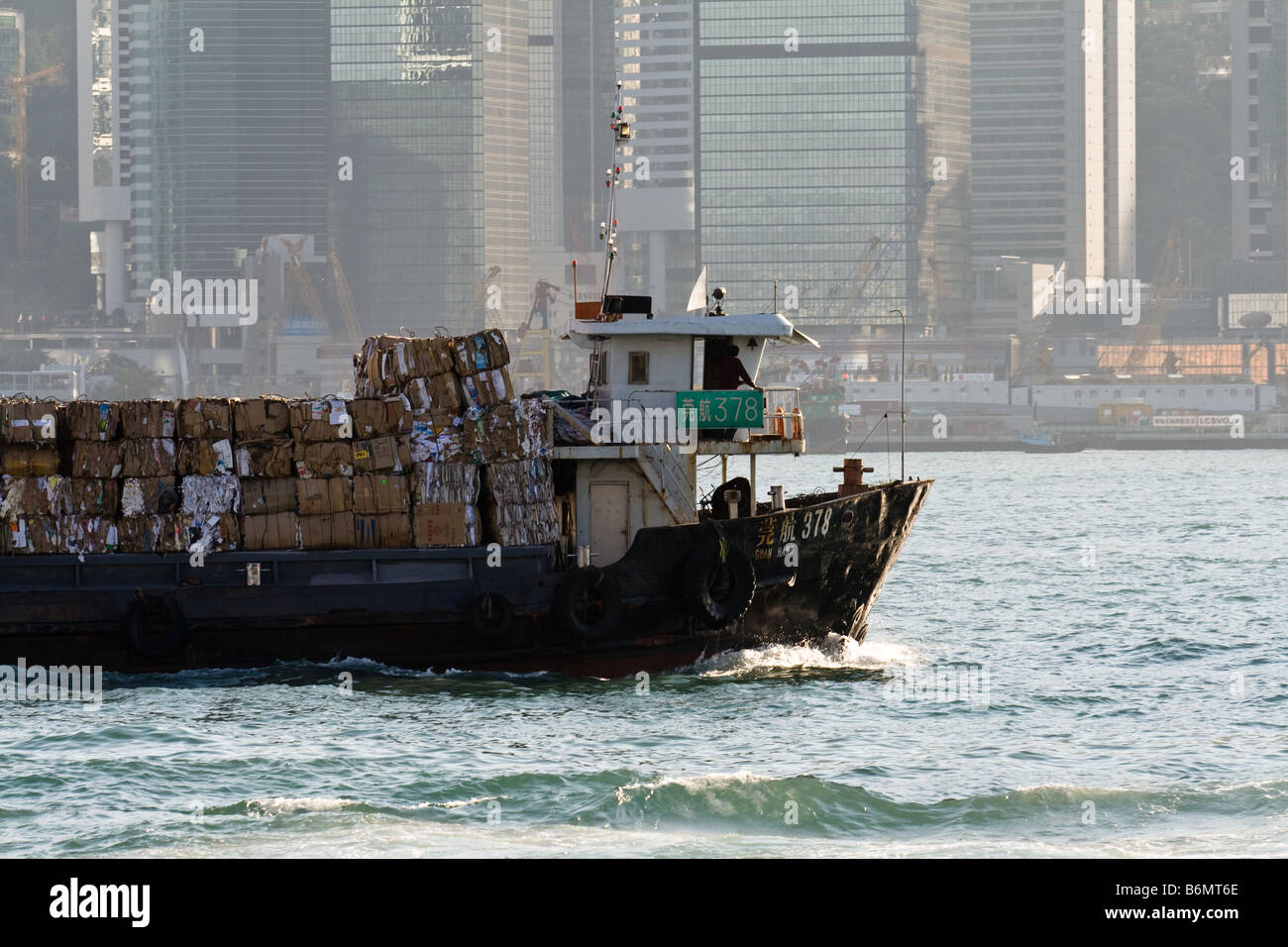 A ship with recycling goods going through Victoria Harbor Stock Photo ...