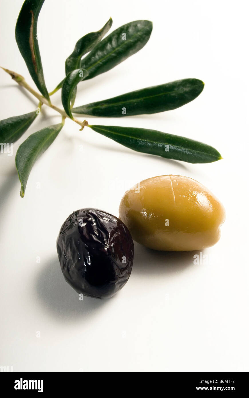 different olives and olive branch isolated on white Stock Photo - Alamy