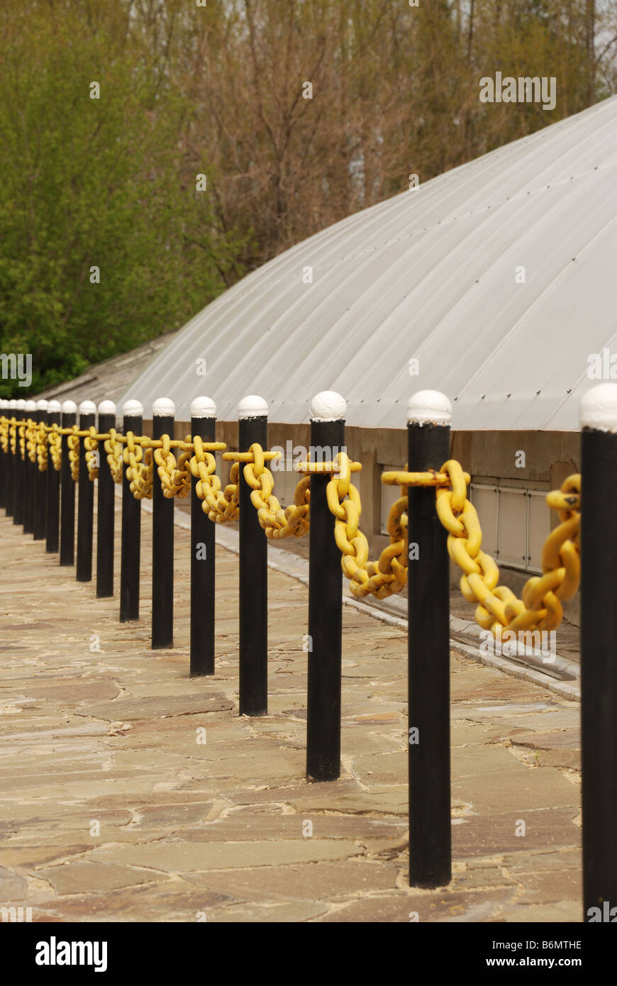 Fence from iron racks and a gold chain A protection of the big hangar ...
