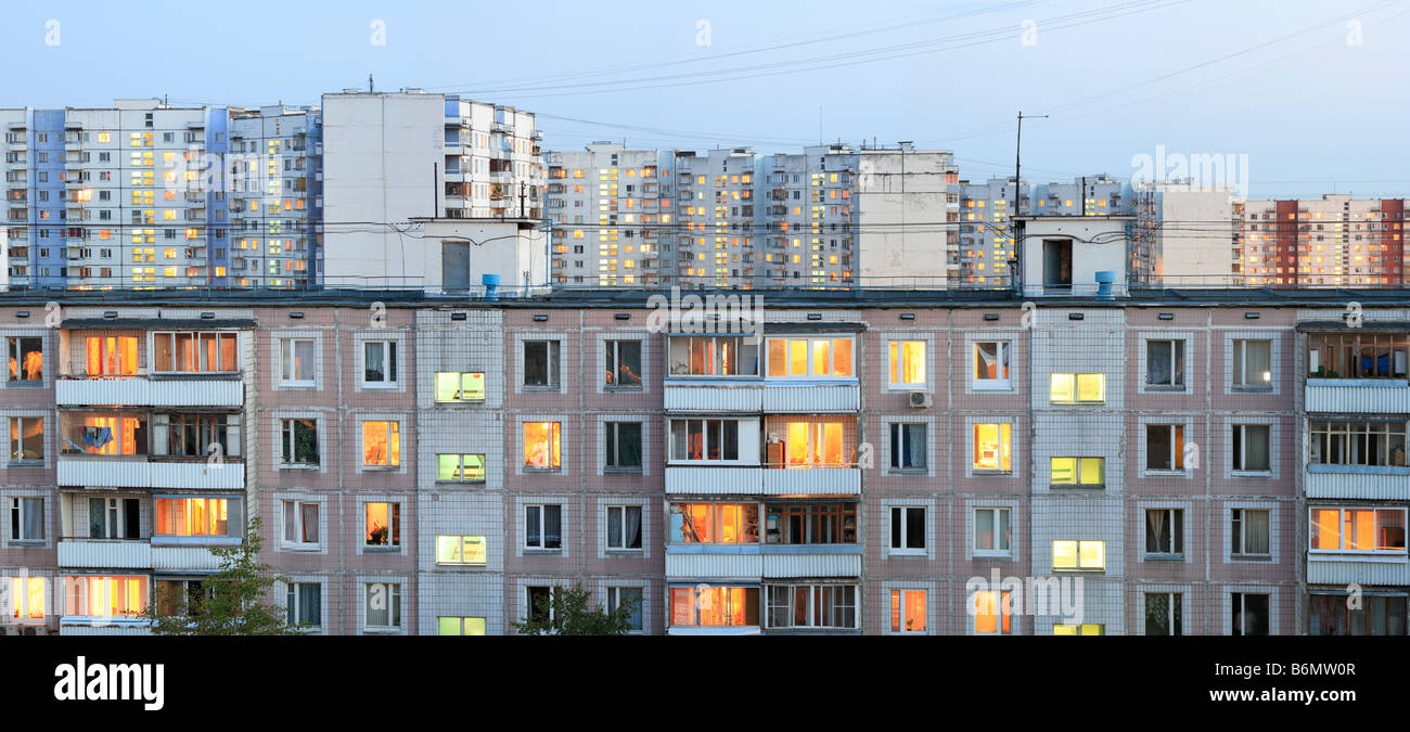 Cityscape, city, 1980s apartment buildings in the evening with lights ...