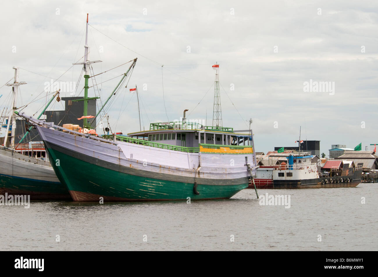 Boats moored at Kumai port, Kalimantan, Borneo, Indonesia Stock Photo ...