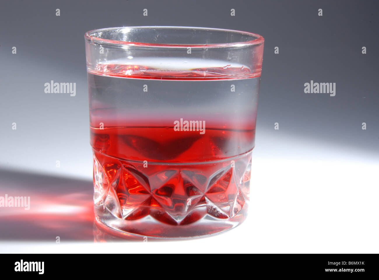 Glass of fresh water and juice on white background Stock Photo - Alamy