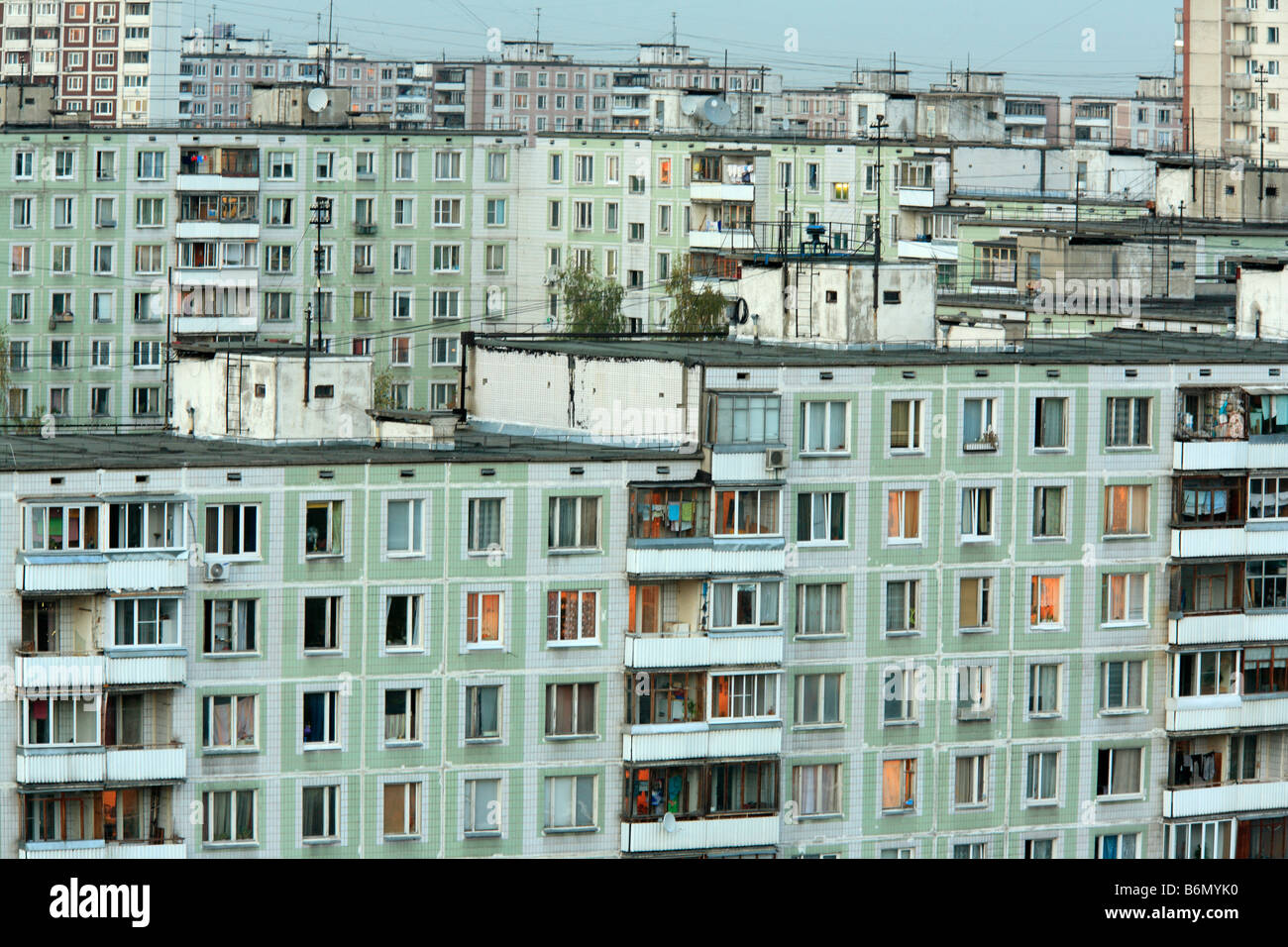 Cityscape, city, 1980s apartment buildings in the evening with lights ...