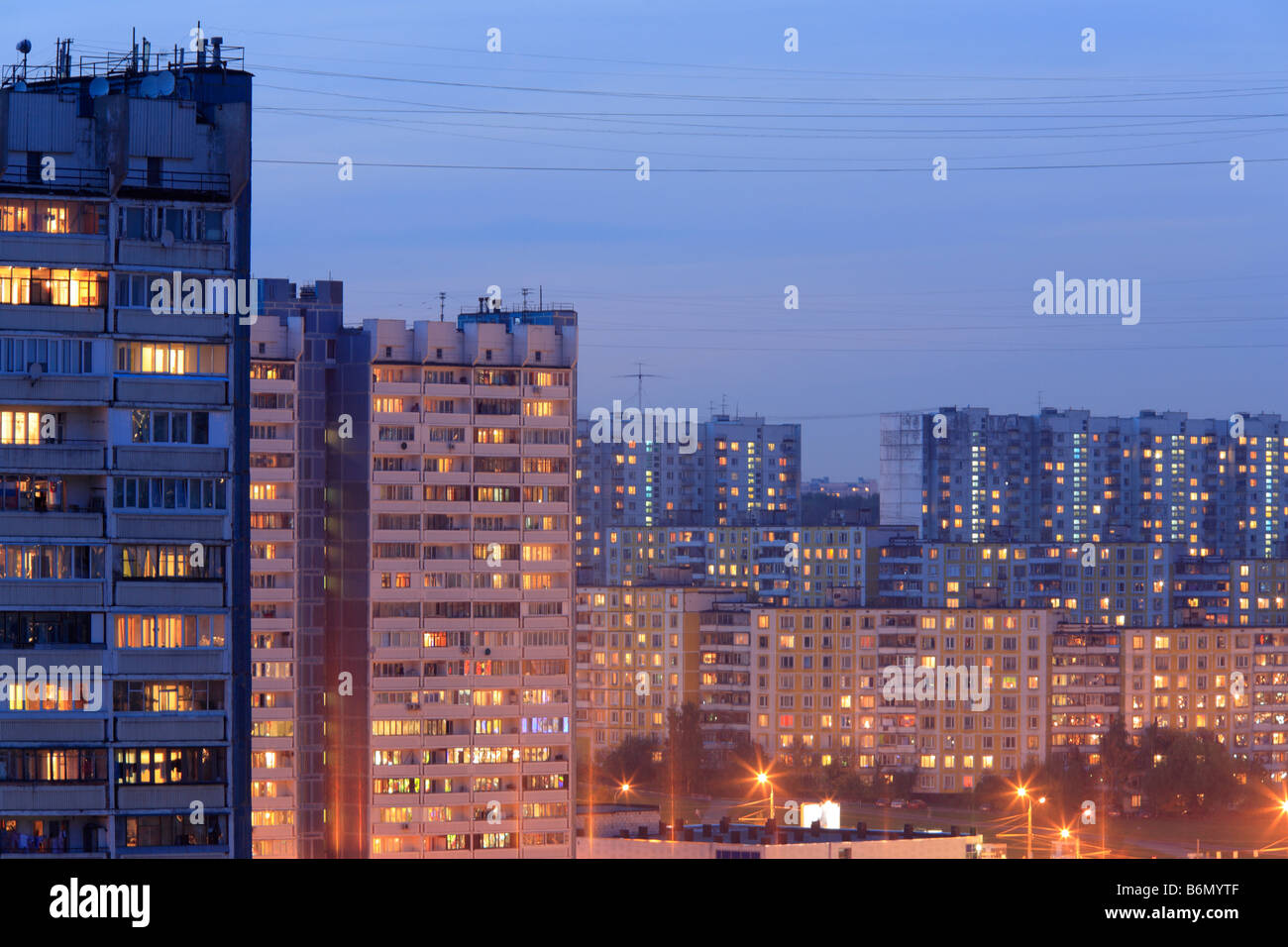 Cityscape, city, 1980s apartment buildings in the evening with lights ...