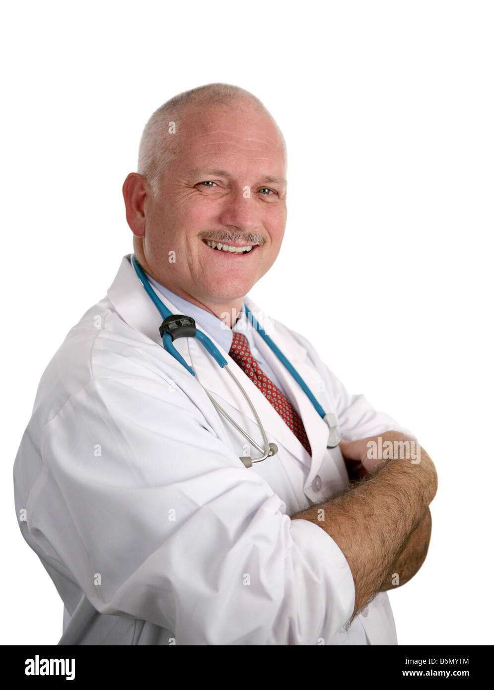 A friendly compassionate doctor smiling against a white background ...