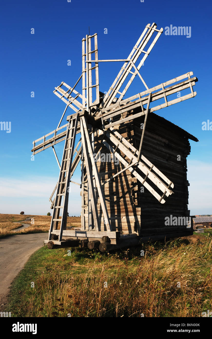 old wooden windmill at the road in summer Stock Photo - Alamy