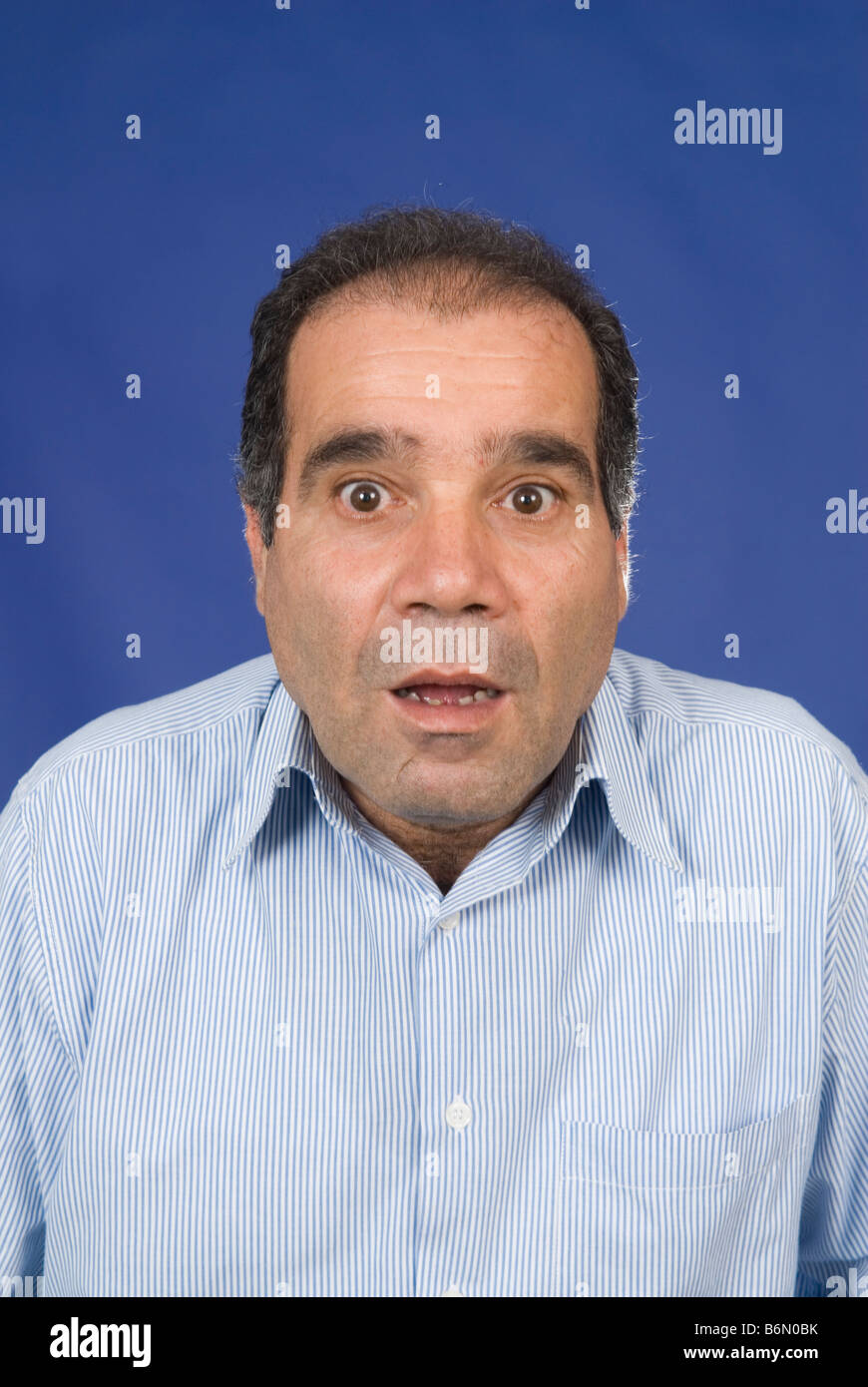 Man looking at camera in shock Stock Photo - Alamy