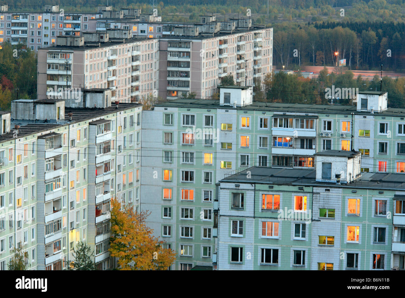 Cityscape, city, 1980s apartment buildings in the evening with lights ...