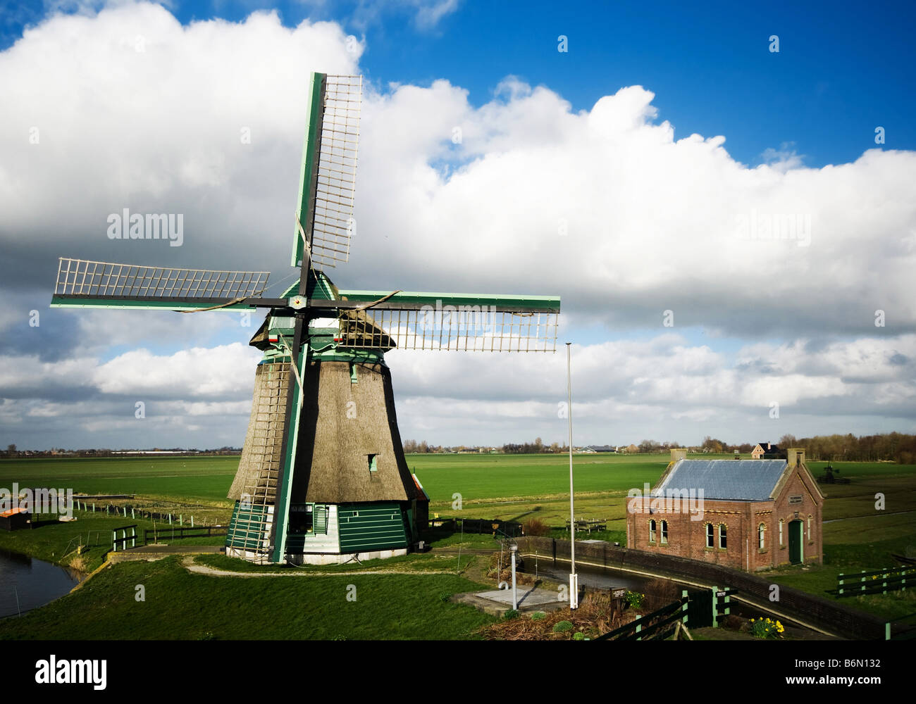 beautiful windmill landscape near the IJsselmeer in the netherlands ...