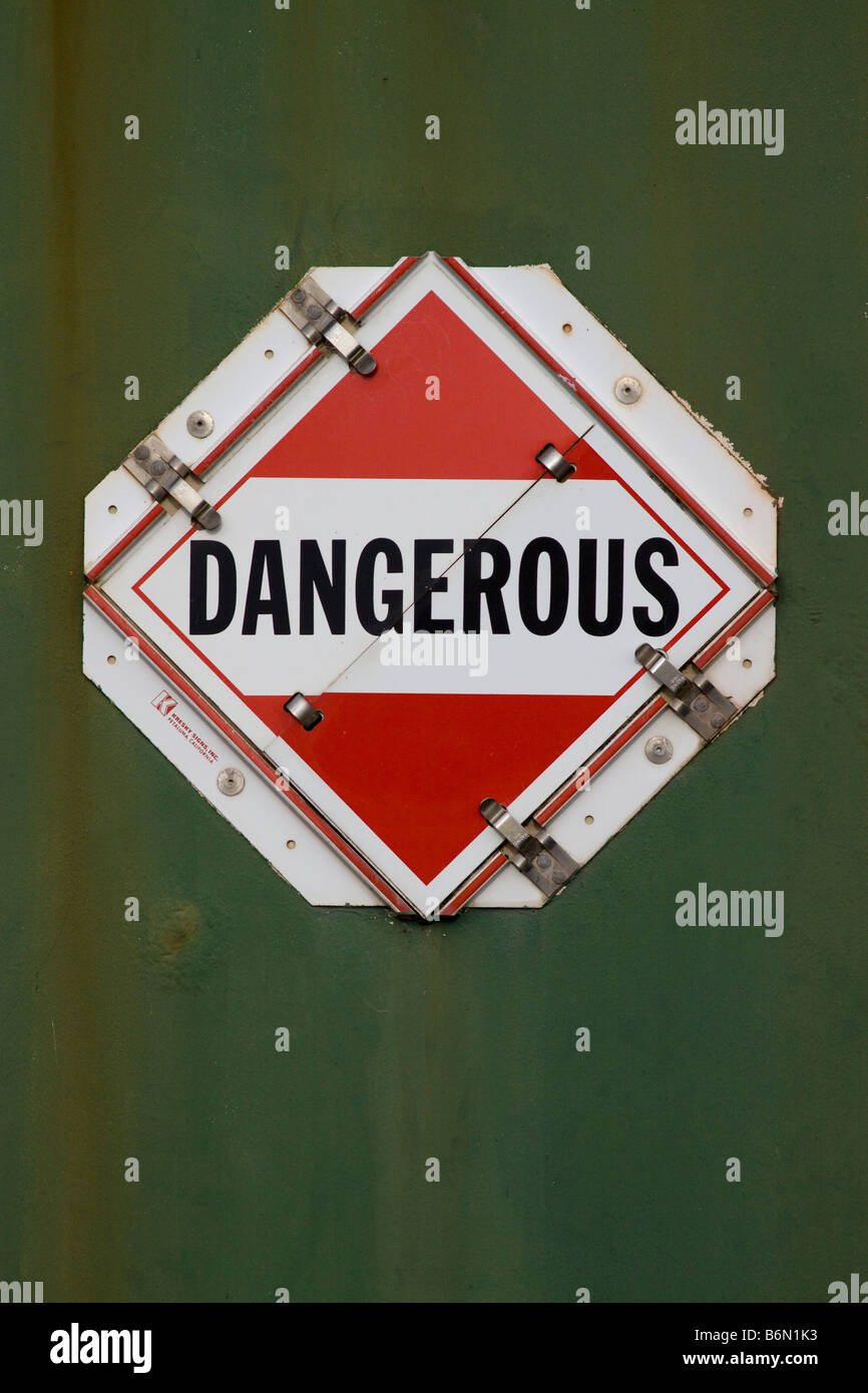 Red sign warning dangerous Stock Photo - Alamy