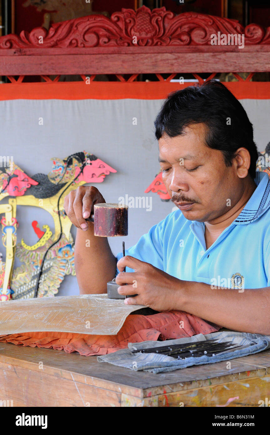 Javanese people making a wayang kulit with the traditional method Stock ...
