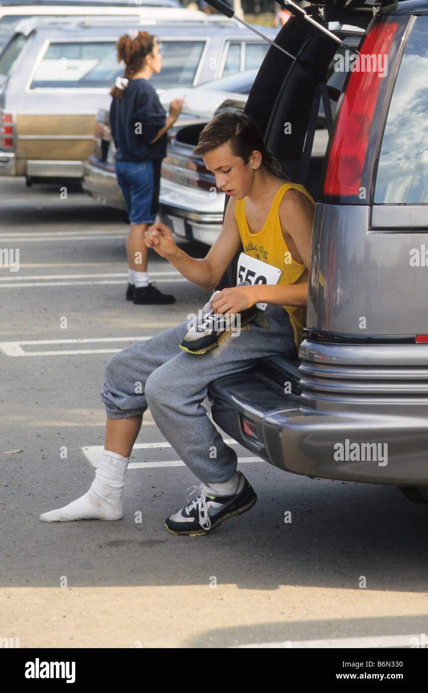 Marathon runner rests after race Stock Photo - Alamy