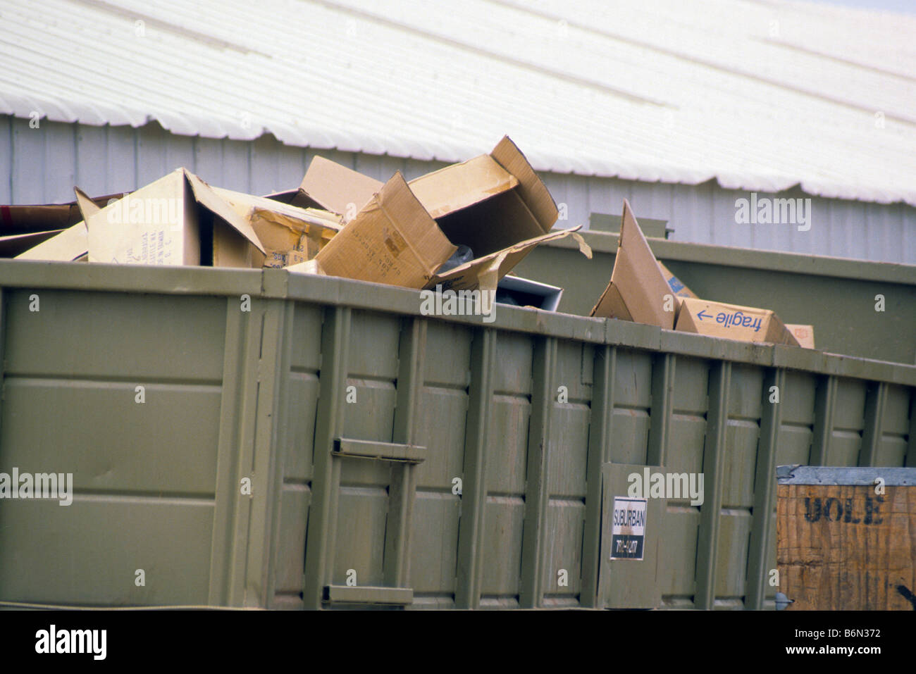 Cardboard boxes fill trash bin before going to recycle center Stock ...