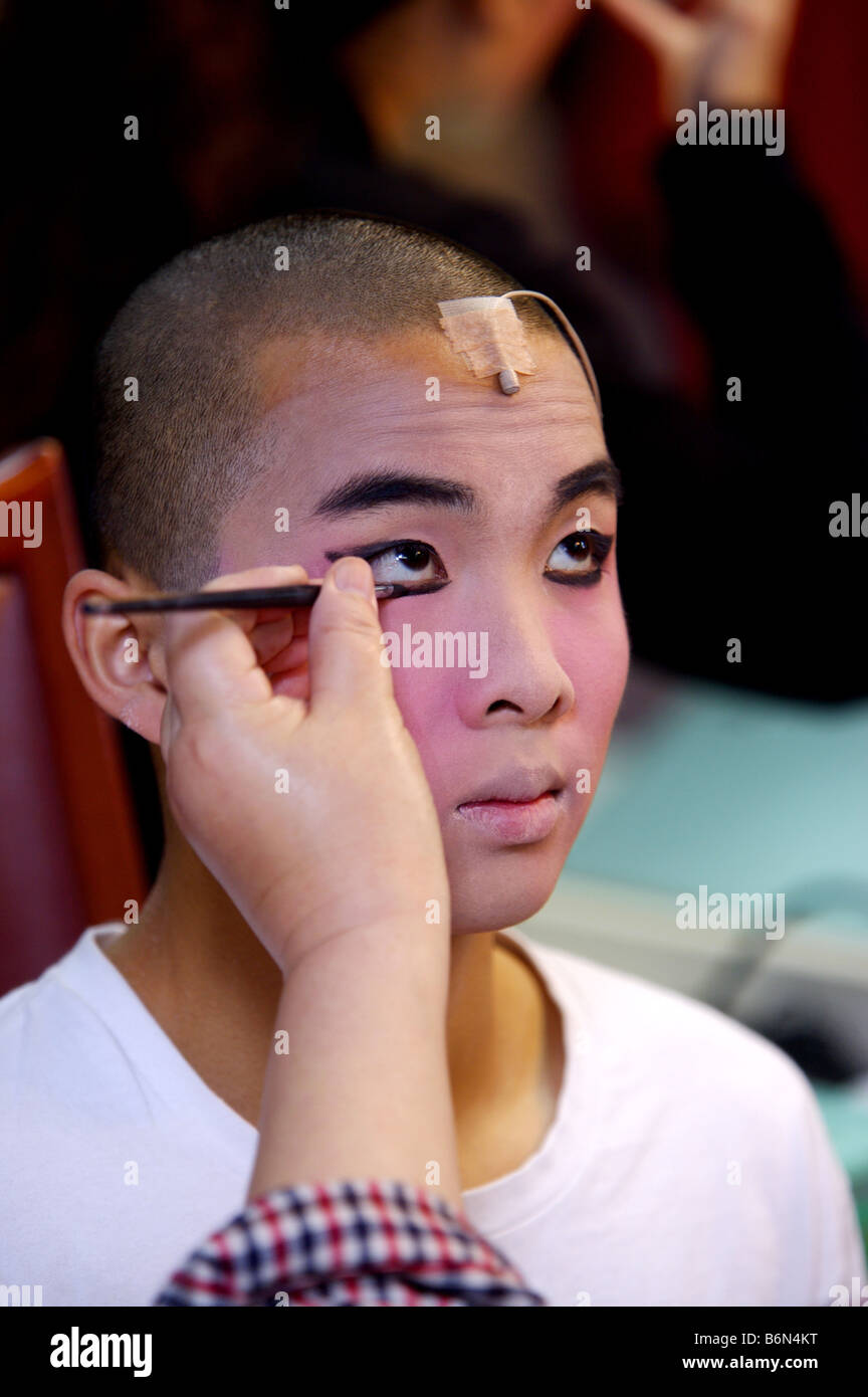 Makeup artists applying makeup to actor s eyes Stock Photo - Alamy