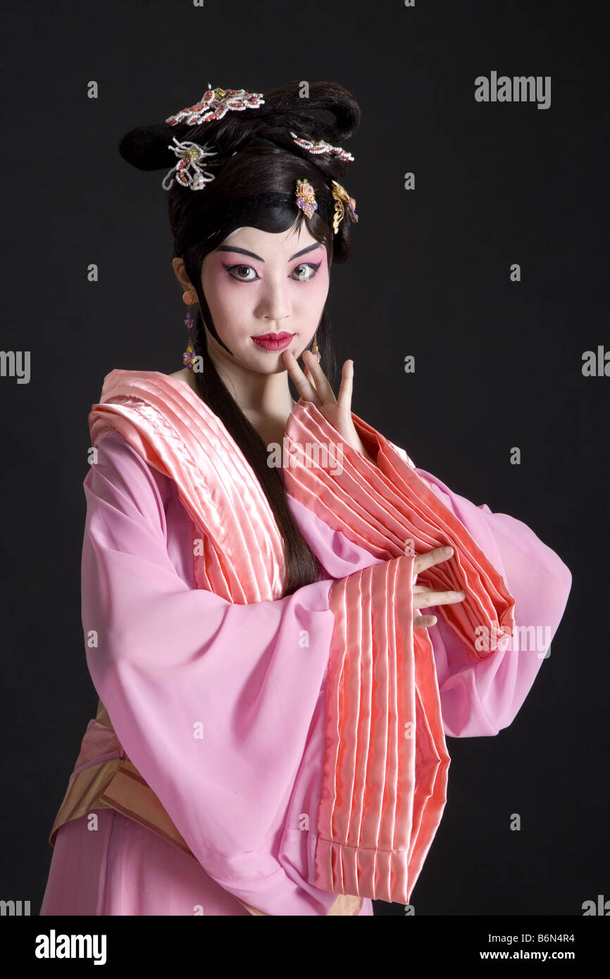 Portrait of Beijing opera performer in traditional dress and make up ...
