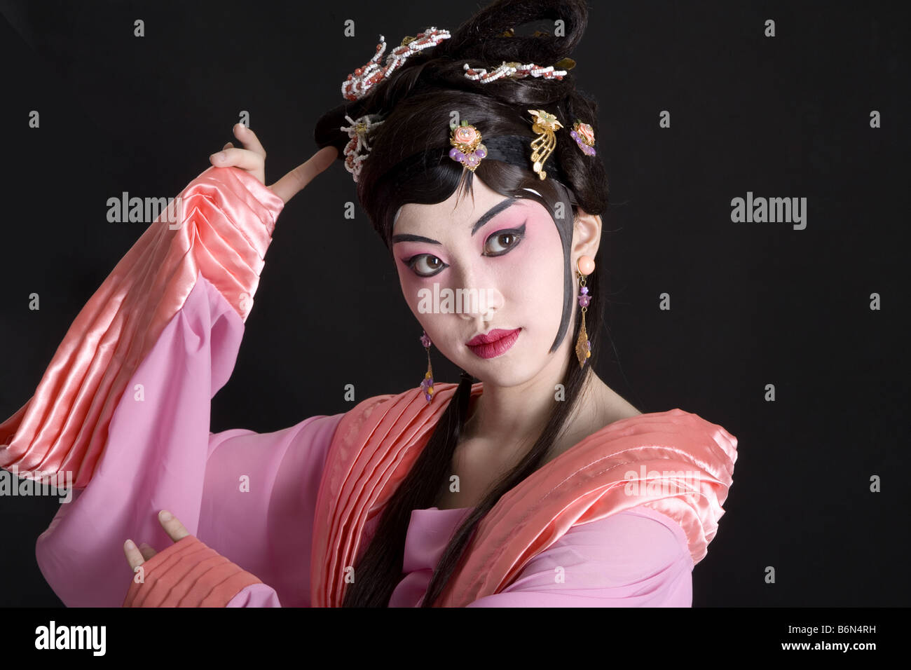 Portrait of Beijing opera performer in traditional dress and make up ...