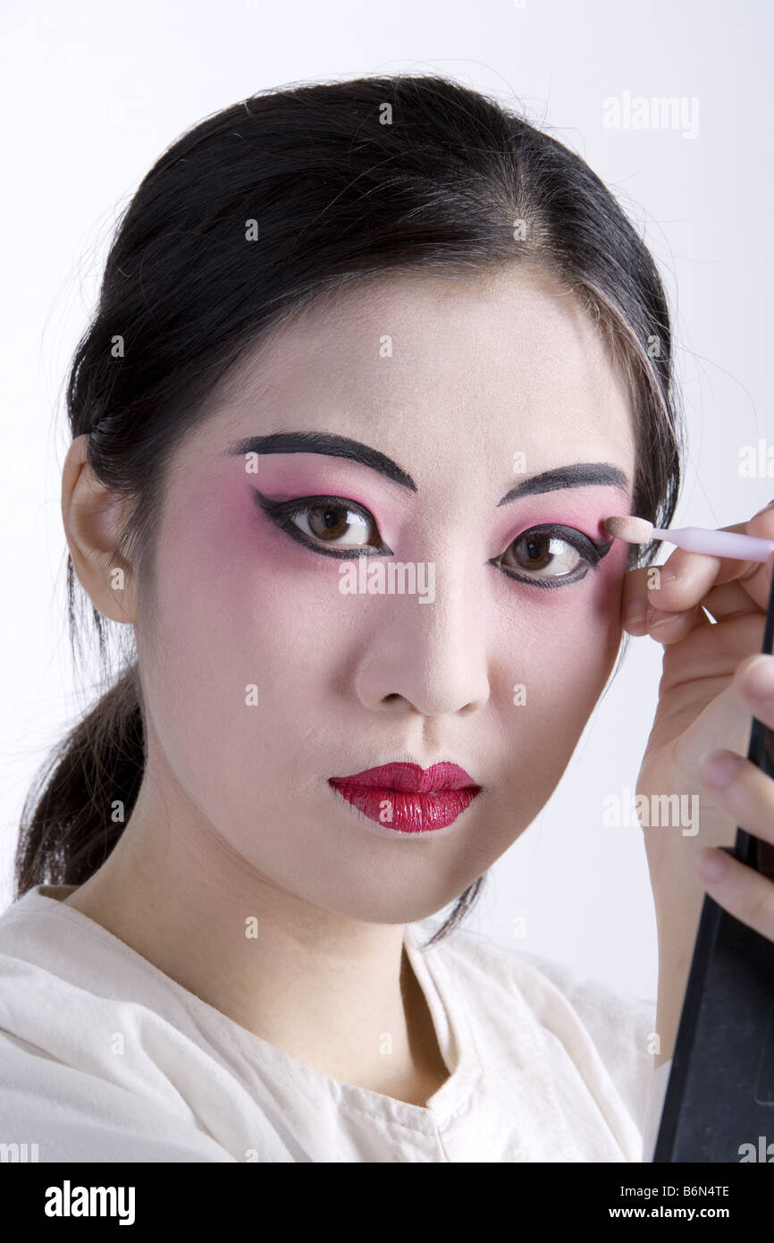 Beijing Opera performer preparing make up Stock Photo - Alamy
