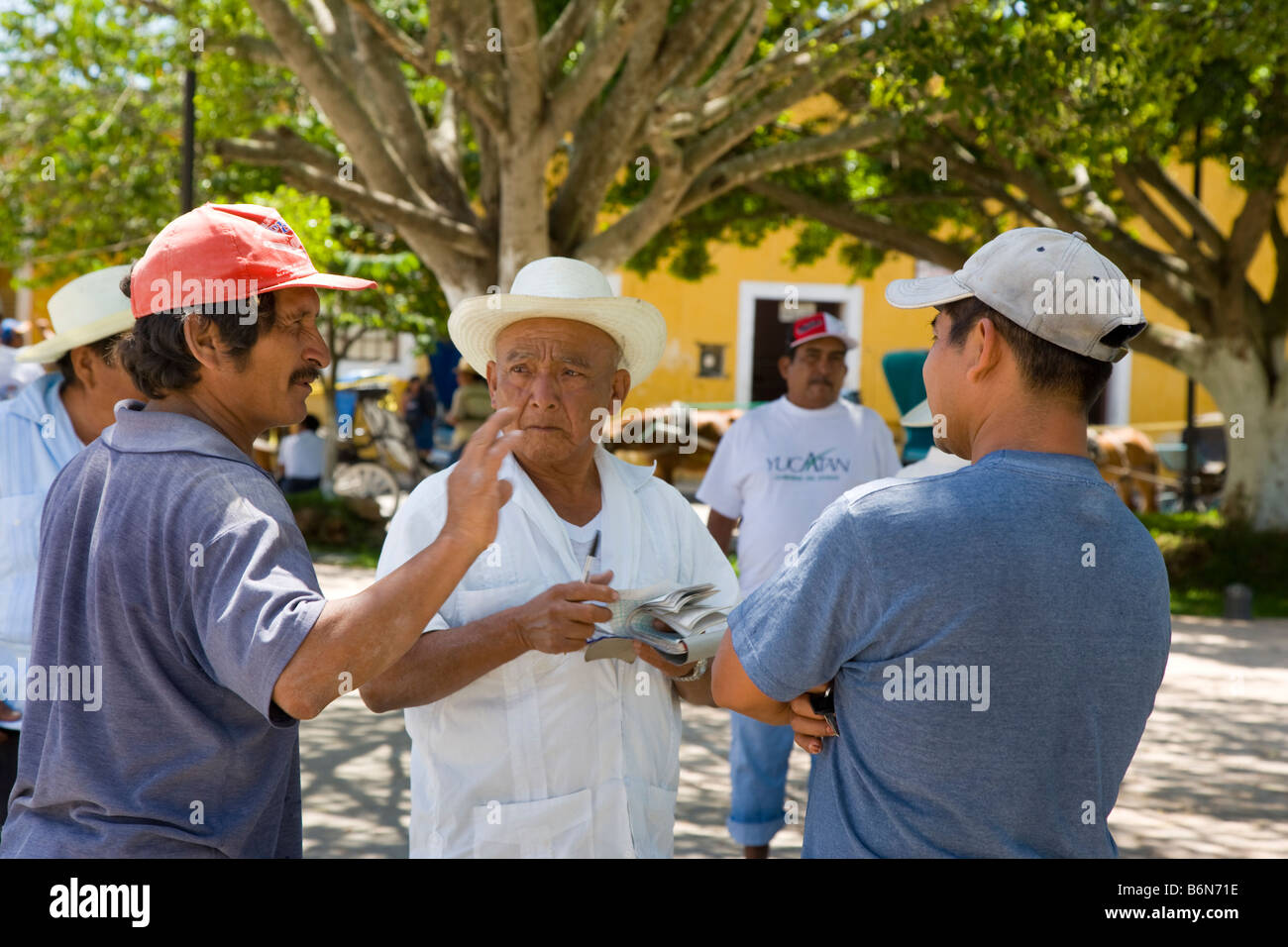 Locals conducting business in the open air Izamal Yucatan Mexico Stock ...